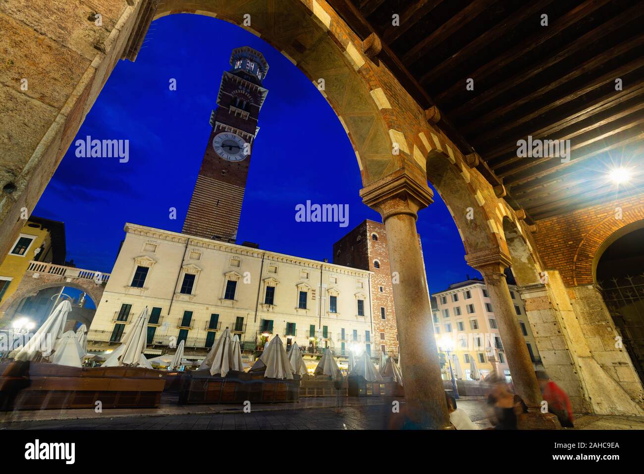 Vibrant nightlife of Verona illuminated central streets on warm fall ...