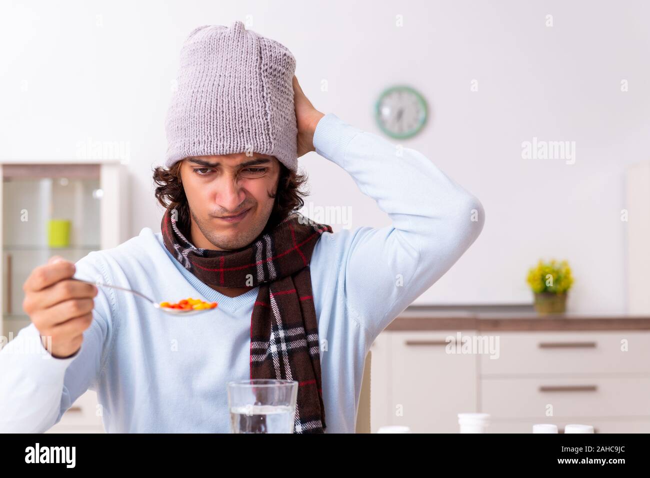 Young man suffering from flu at the home Stock Photo - Alamy