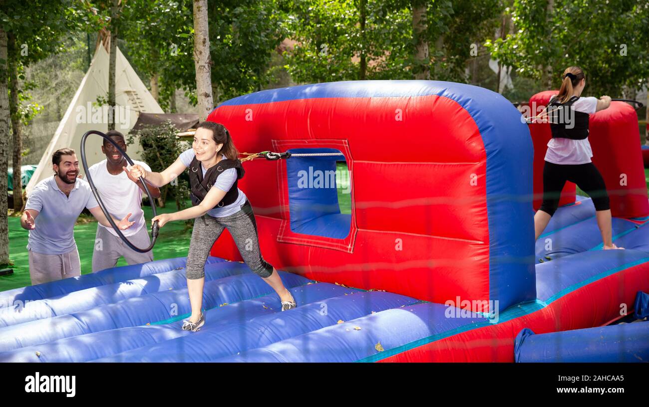 Competition of two women - who quickly throw a hoop on a stick Stock ...