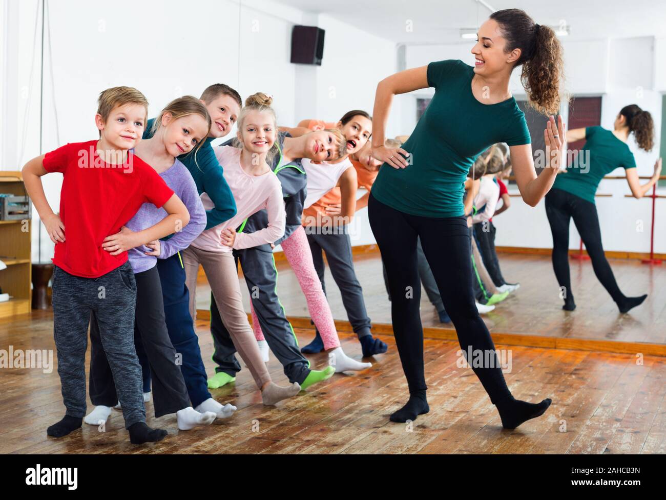 Happy cheerful children dancing contemp in studio smiling and having ...
