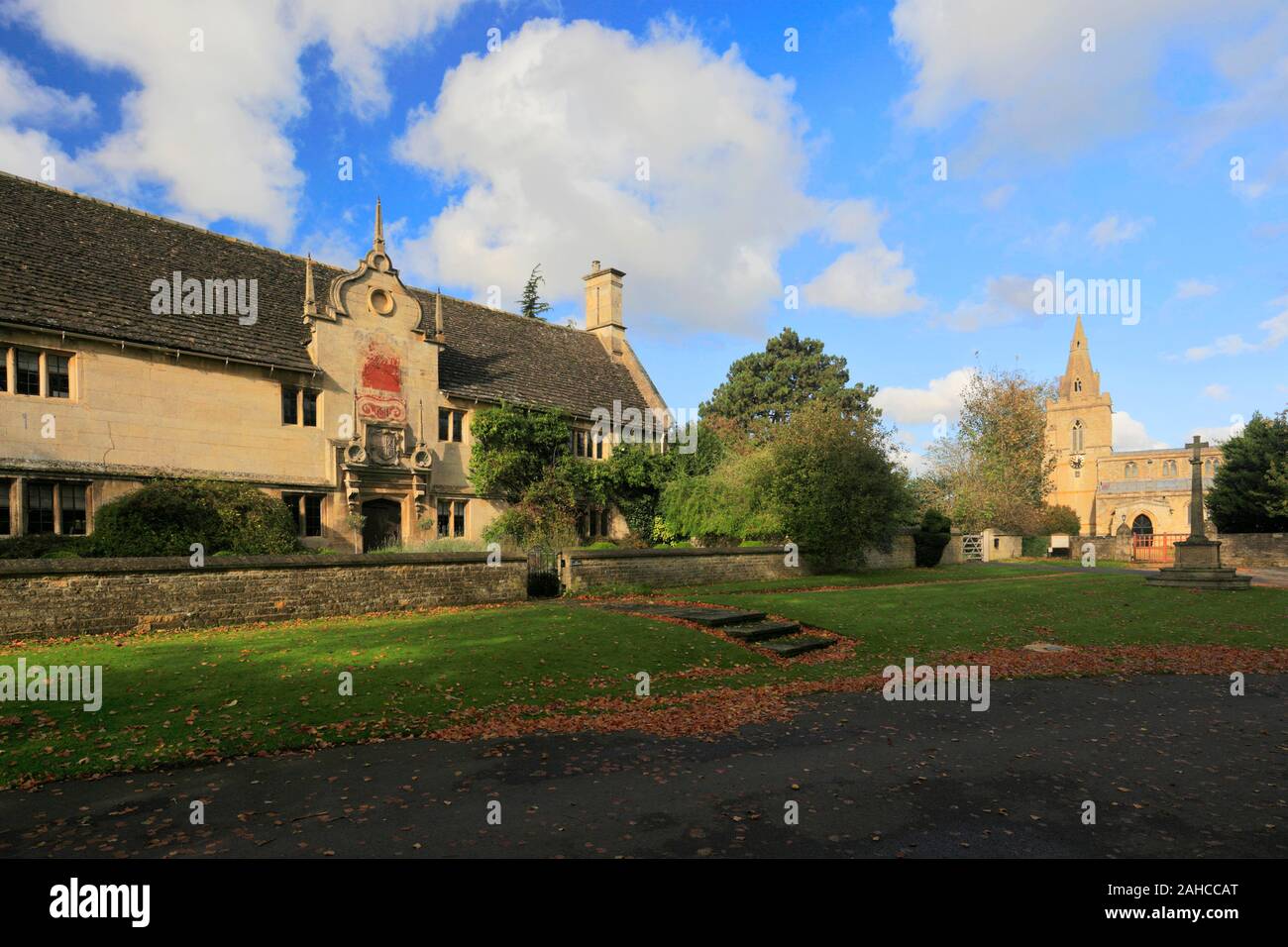 The Old Almshouses and St Marys parish church, Weekley village ...