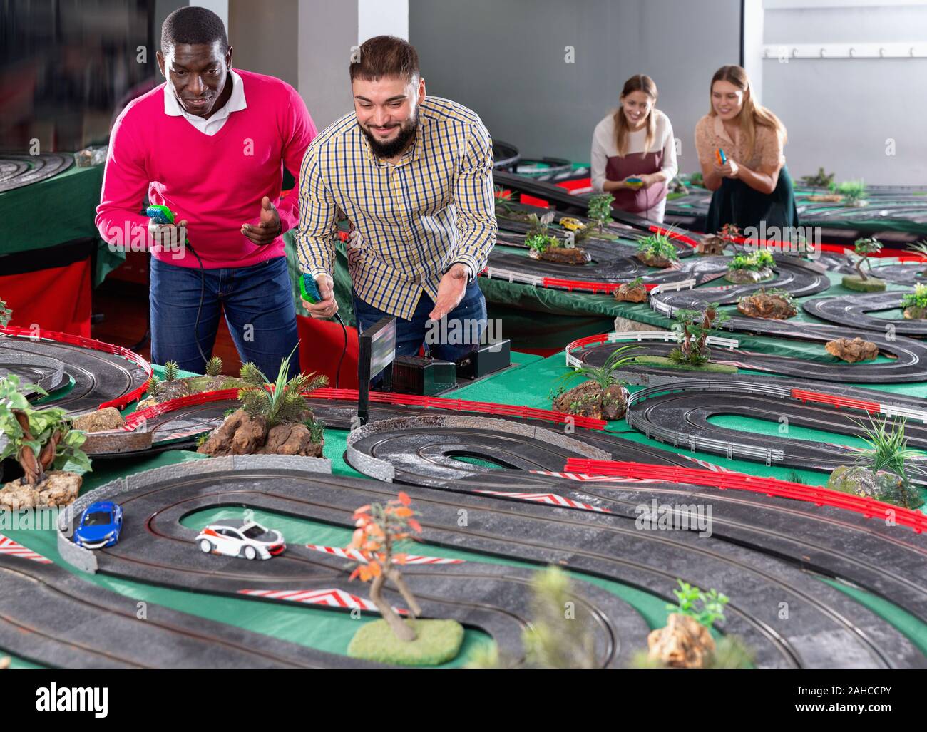 Two people with remote control cars hi-res stock photography and images ...