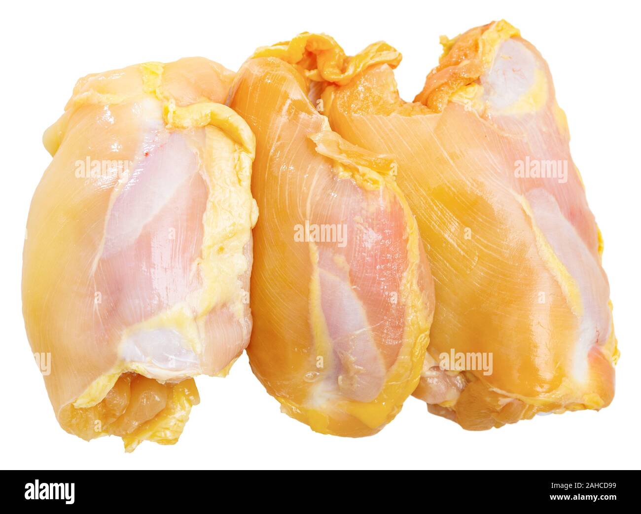 Raw skinless chicken thighs. Isolated over white background Stock Photo ...