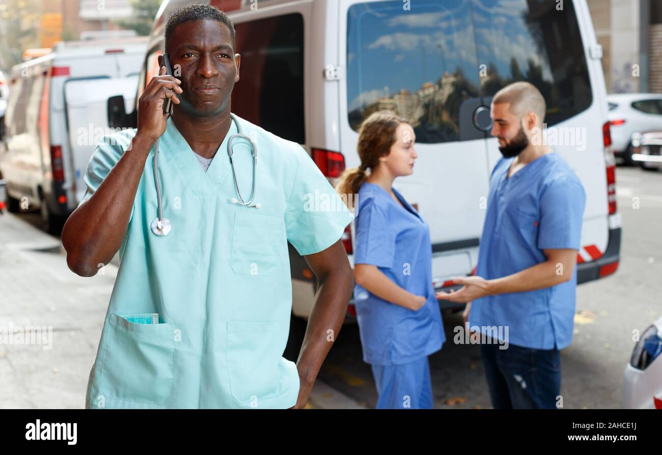 ambulance team going to call with medical equipment outdoor Stock Photo ...