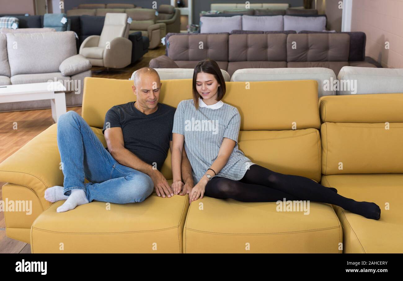 Family testing new furniture hi-res stock photography and images - Alamy