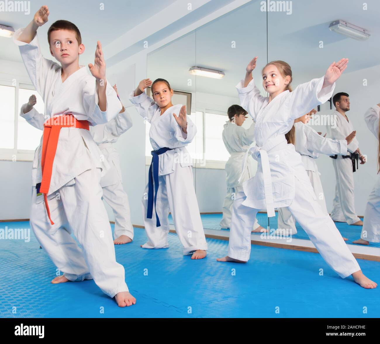 Young children practicing karate moves at karate class Stock Photo - Alamy