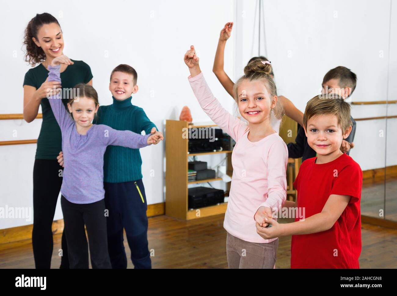 Happy smiling children studying of partner dance at dance school Stock ...