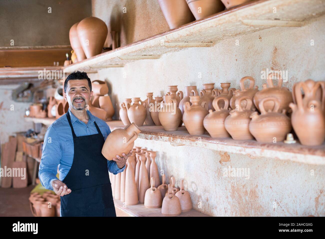 Happy male artisan having hi-res stock photography and images - Alamy
