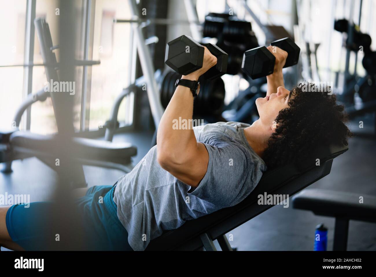 Happy bodybuilder doing exercise hi-res stock photography and images ...