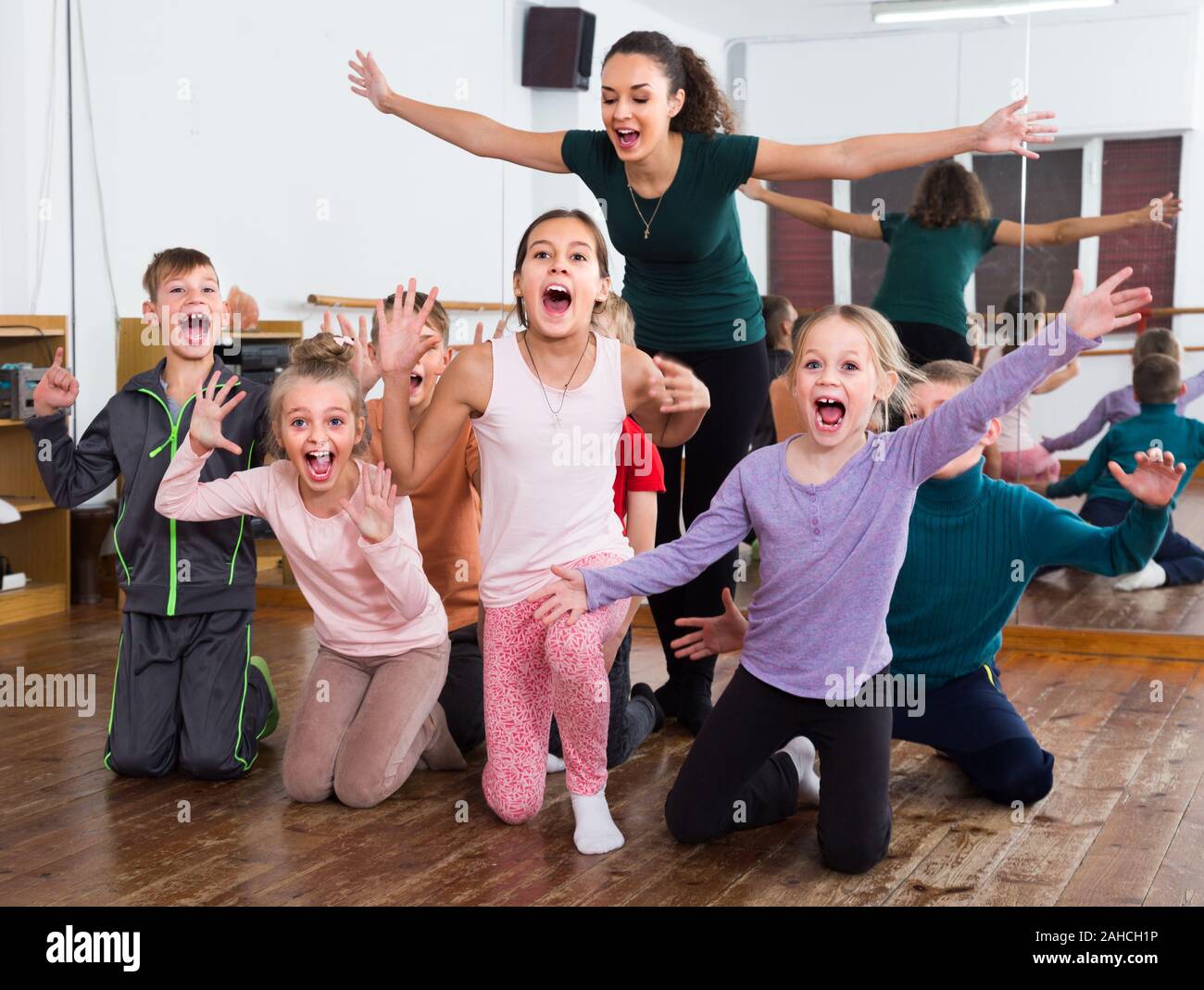 Active emotional schoolchildren posing at dance class Stock Photo - Alamy