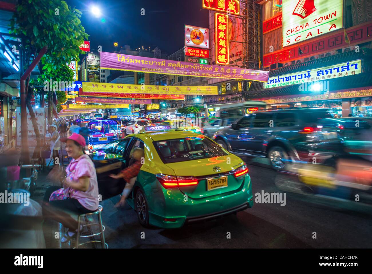 Bangkok/Thailand-December 2019: Night time at Chinatown in Bangkok with bright neon lights and ...
