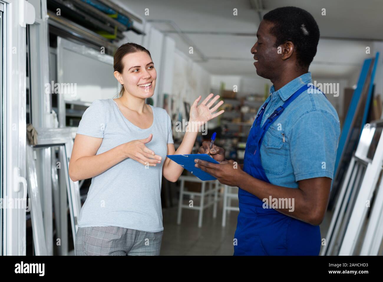 Adult man master is consultating female client about choice modern ...