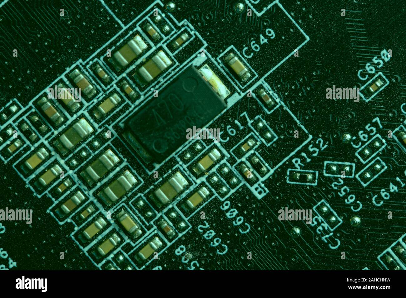 A close up macro photo of a generic technology motherboard circuit ...