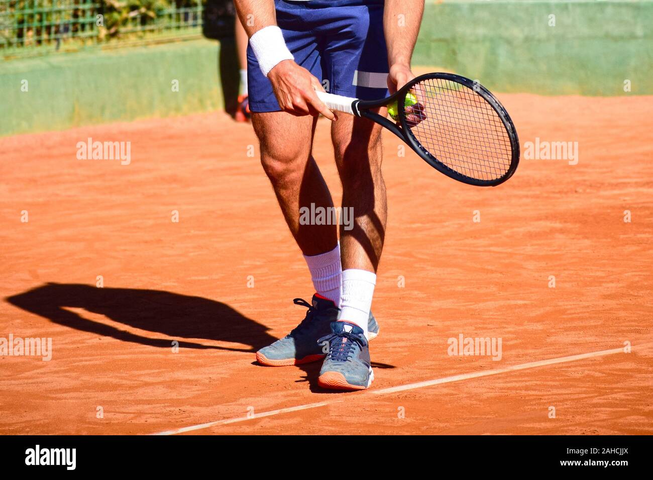 Unknown Tennis player playing a professional tennis match in clay court ...