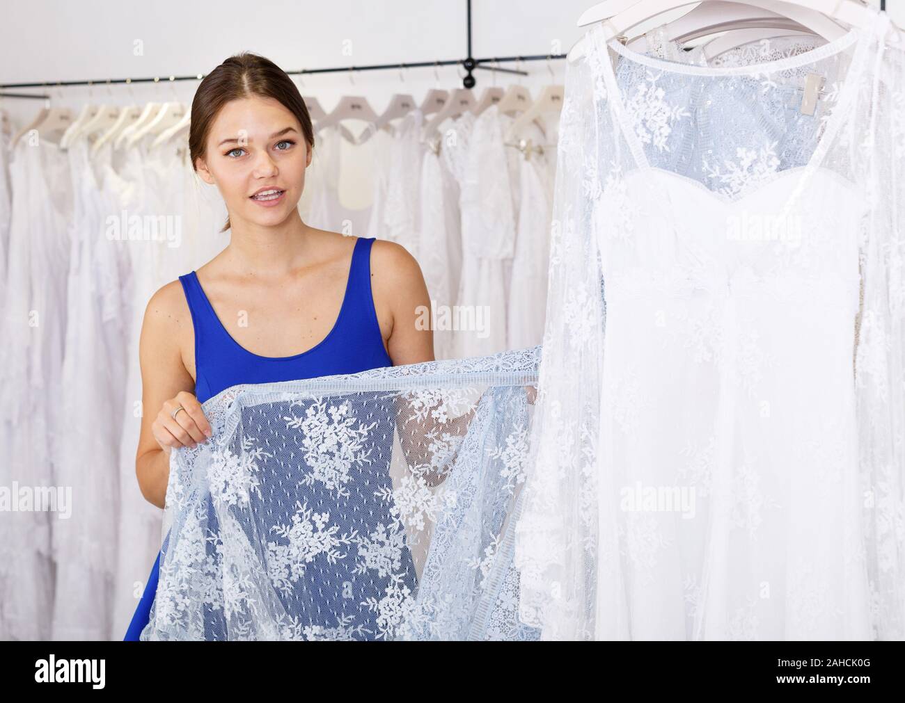 Woman choosing wedding dress in hi-res stock photography and images - Alamy