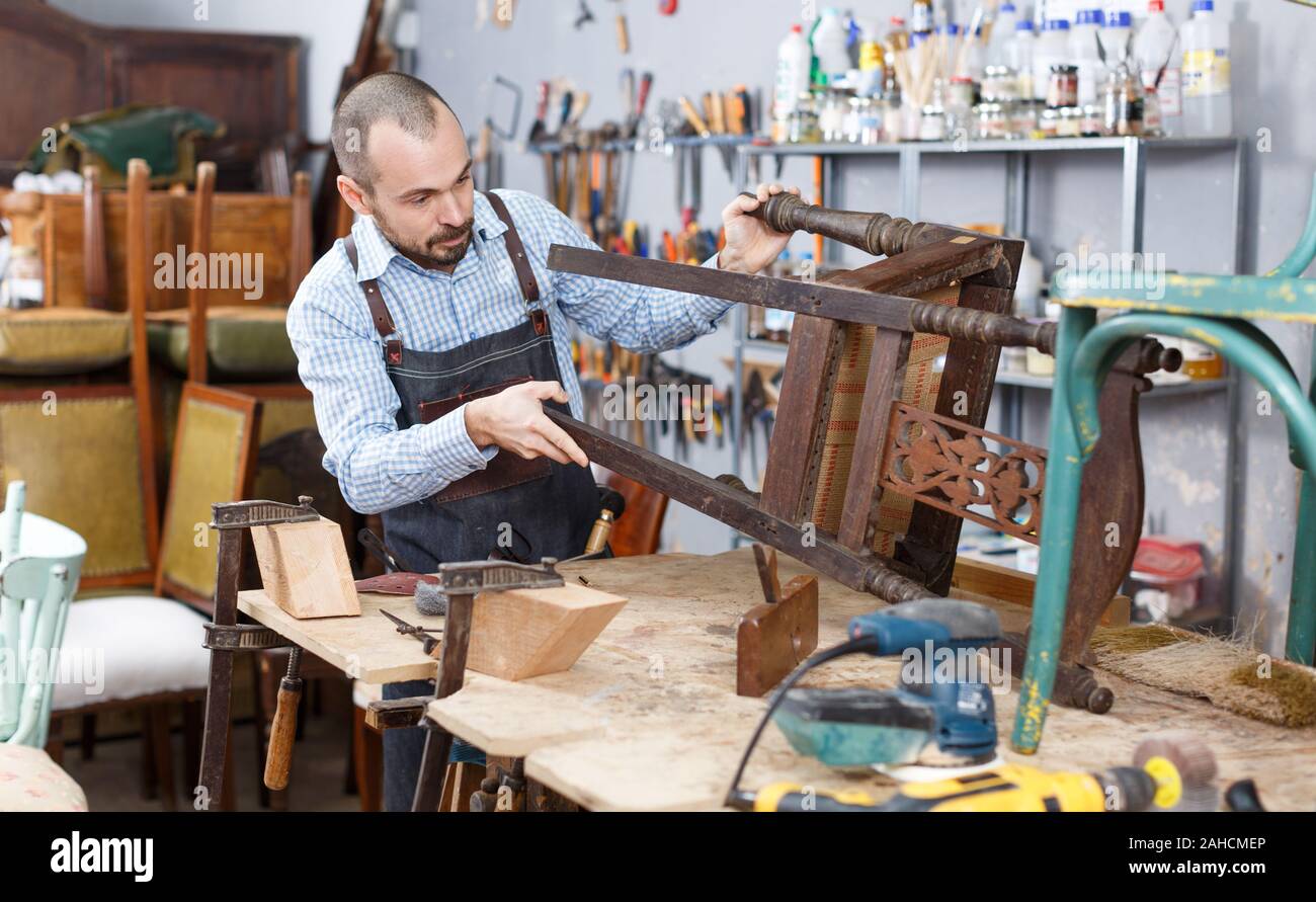 Old woodworker chair hi-res stock photography and images - Alamy