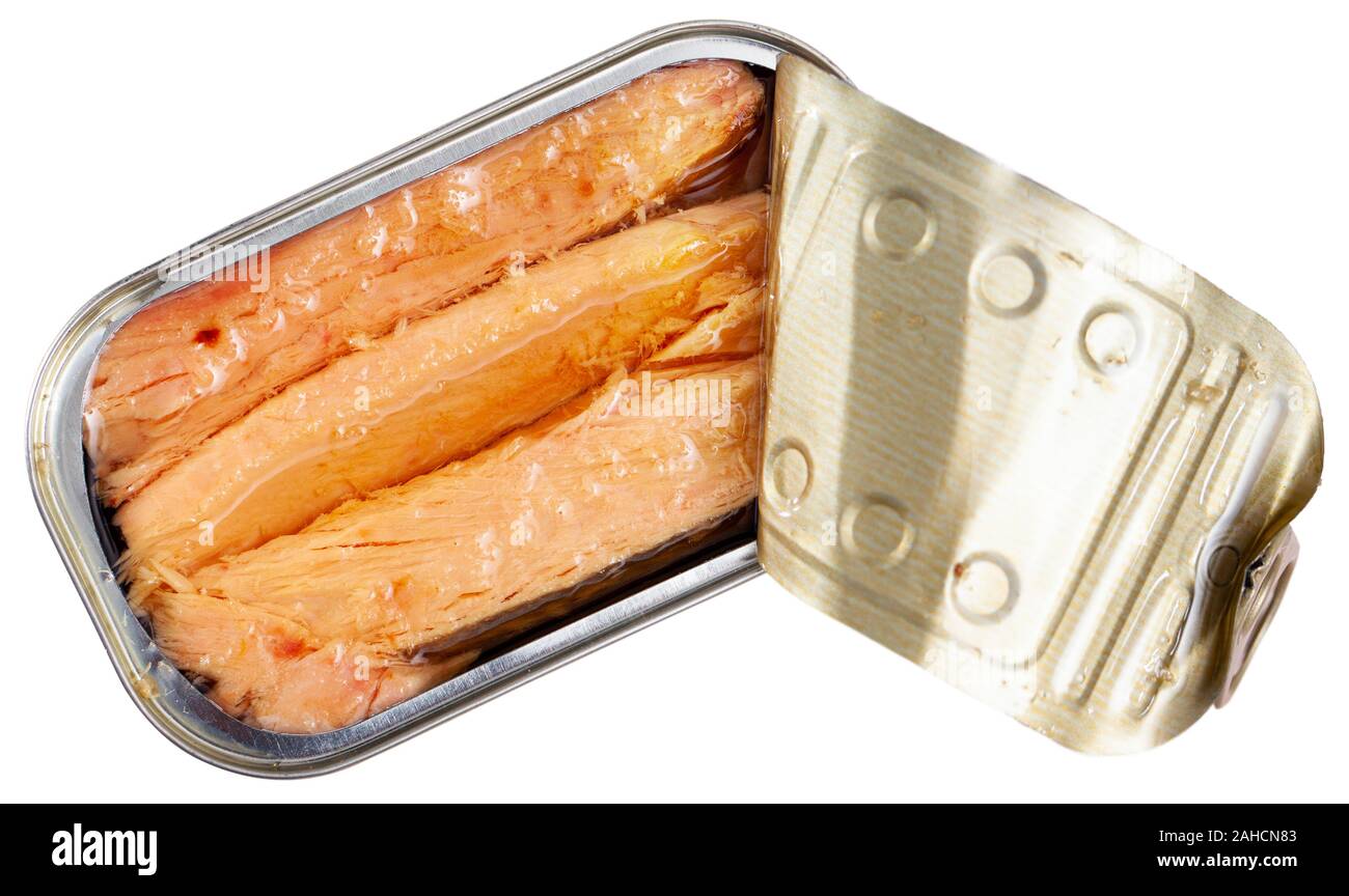 Open can of preserved natural fillet of frigate tuna. Isolated over ...