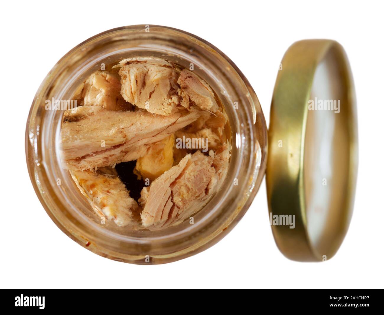 Glass jar with canned tuna in oil. Isolated over white background Stock ...