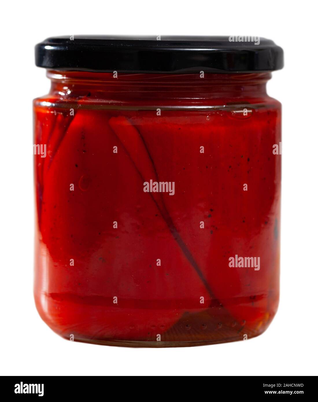 Glass jar with pickled red bell pepper. Isolated over white background ...