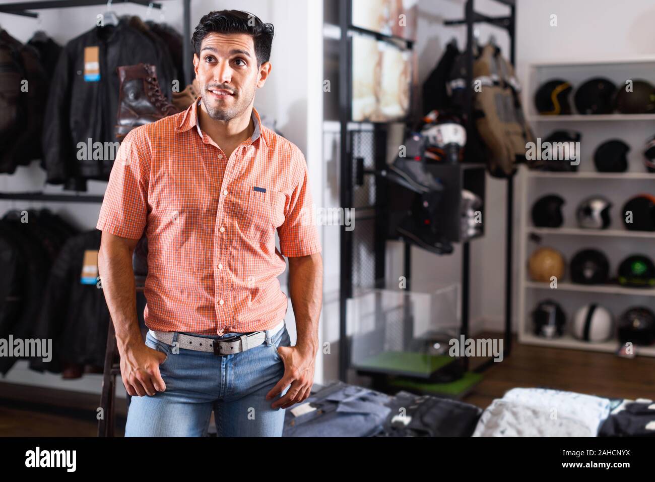 Portrait of glad cheerful positive male customer who is posing in the ...