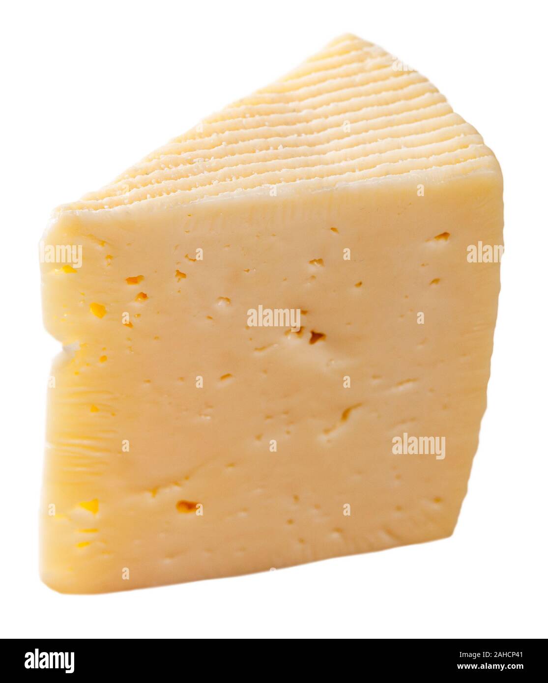 Cut piece of fresh cow cheese. Isolated over white background Stock ...