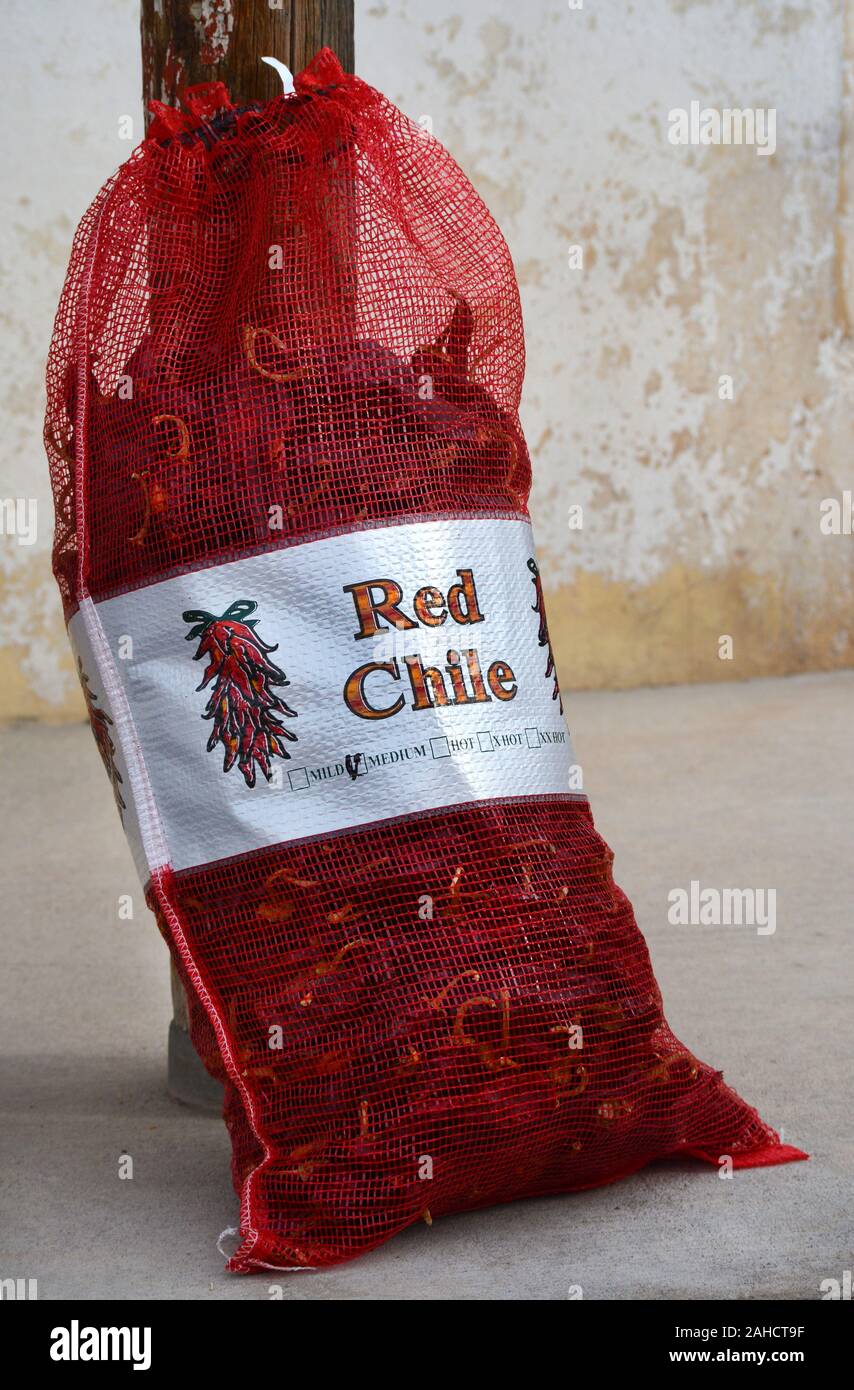 Bags of red Chile peppers available for purchase in a store adjacent to ...