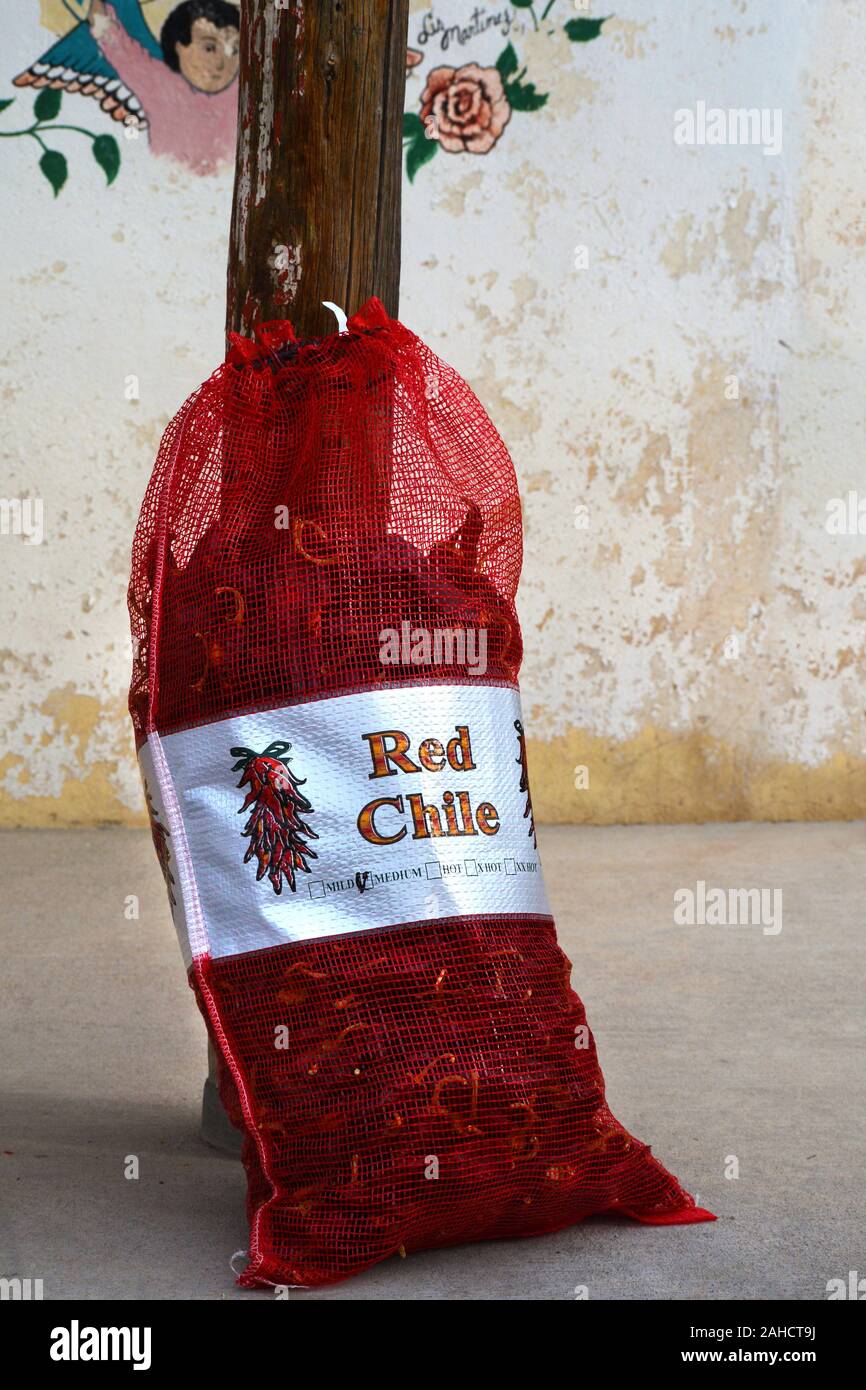 Bags of red Chile peppers available for purchase in a store adjacent to ...