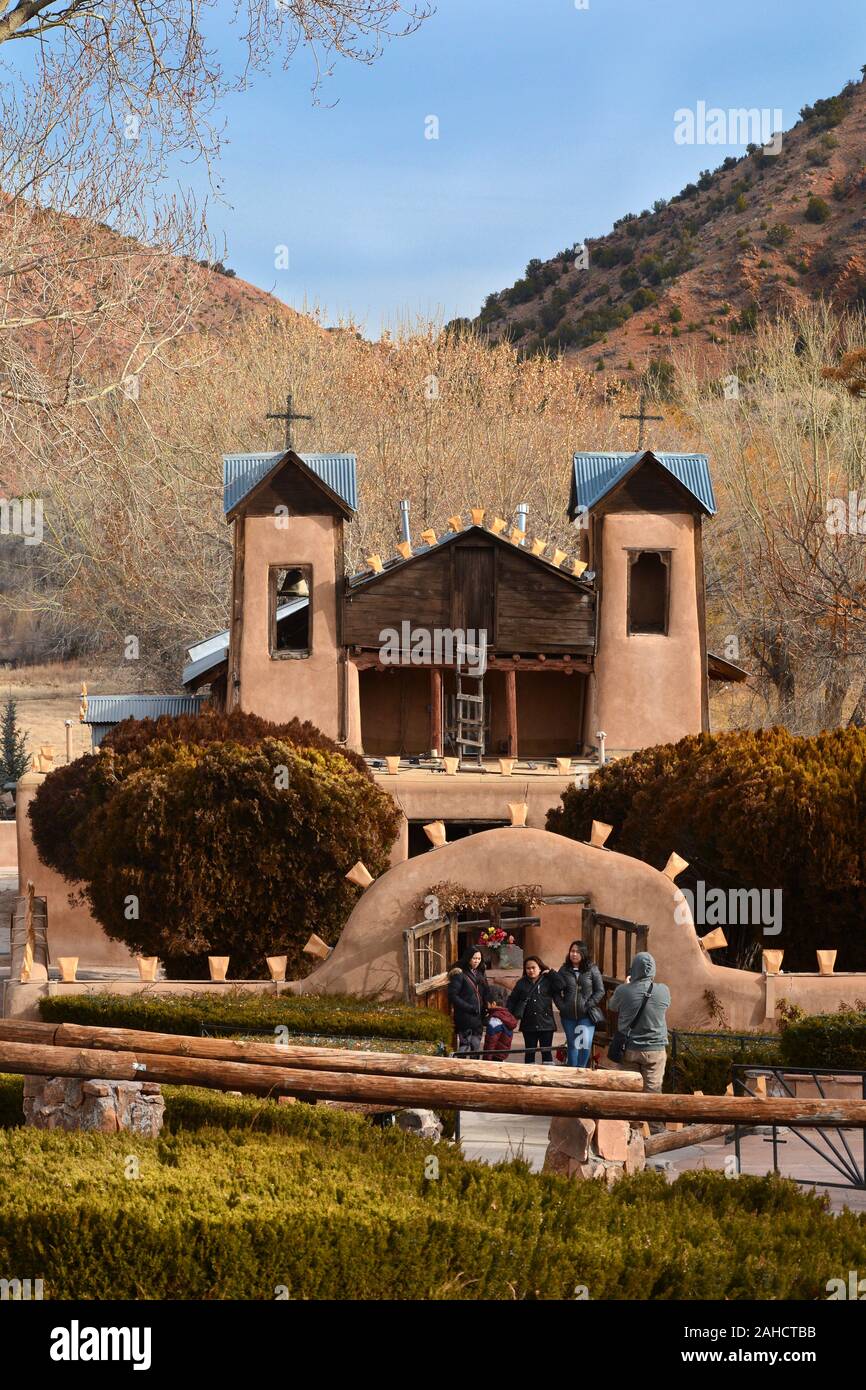 Visitors enter the Santuario de Chimayo, an historic Catholic church ...