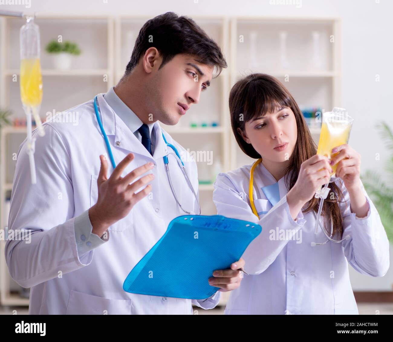 The two doctors discussing plasma and blood transfusion Stock Photo - Alamy