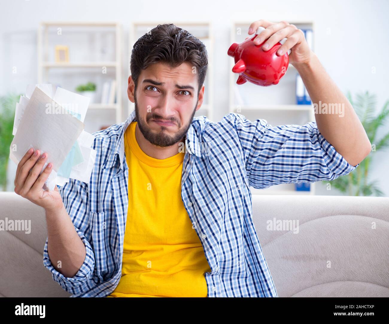 The man angry at bills he needs to pay Stock Photo - Alamy