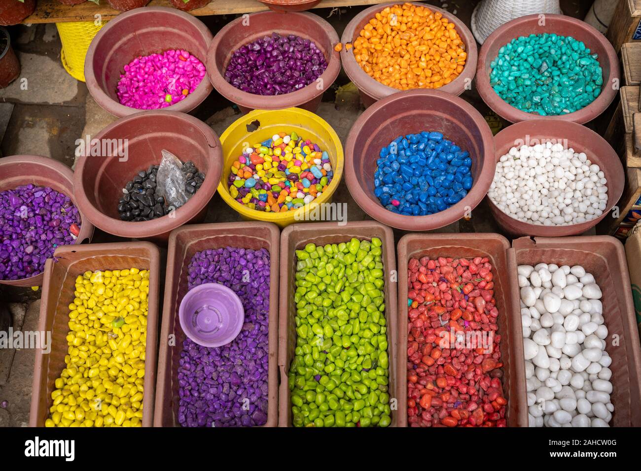 Colorful rocks for sale at an outdoor bazaar market Stock Photo - Alamy