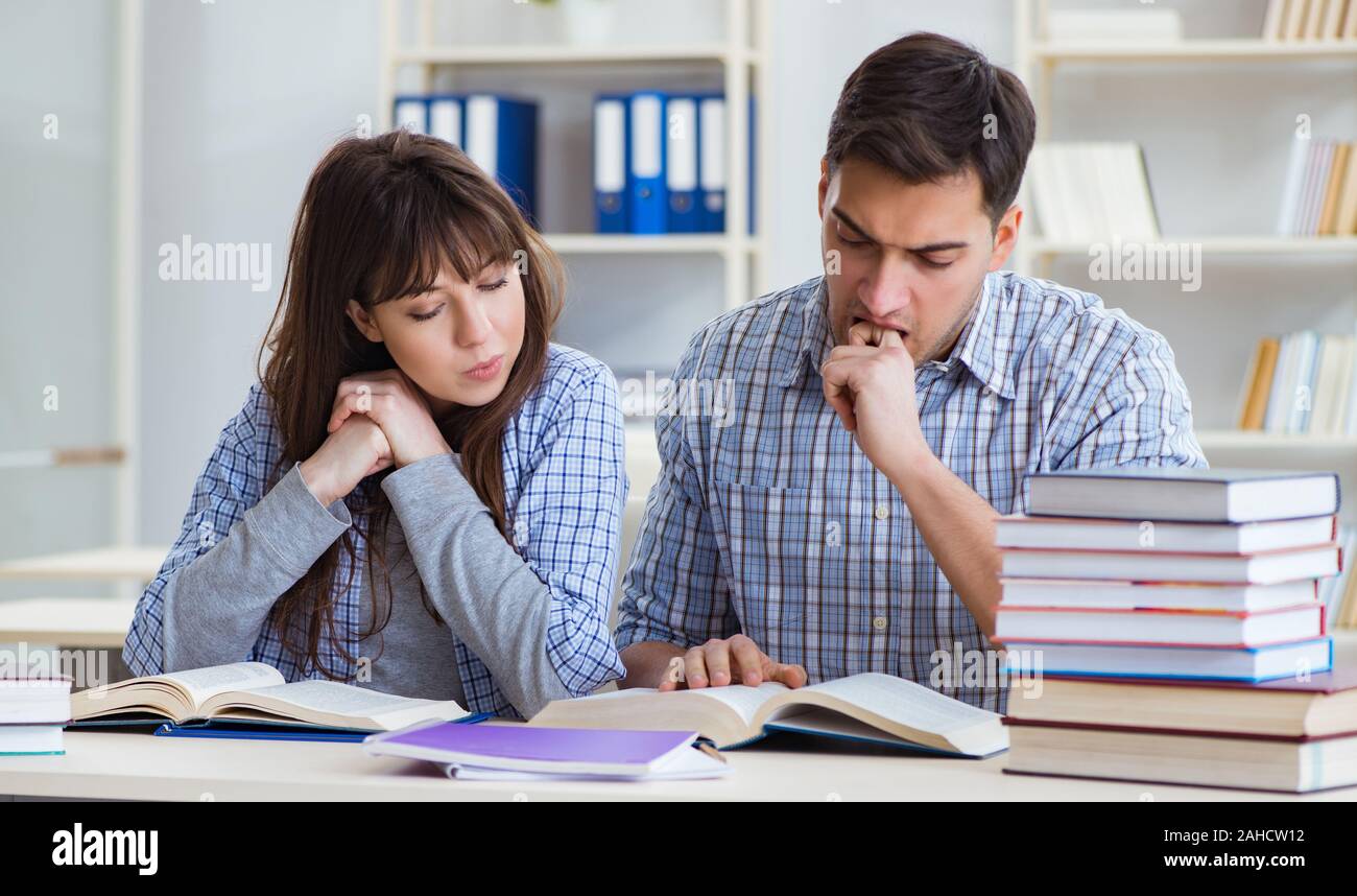 The students sitting and studying in classroom college Stock Photo - Alamy