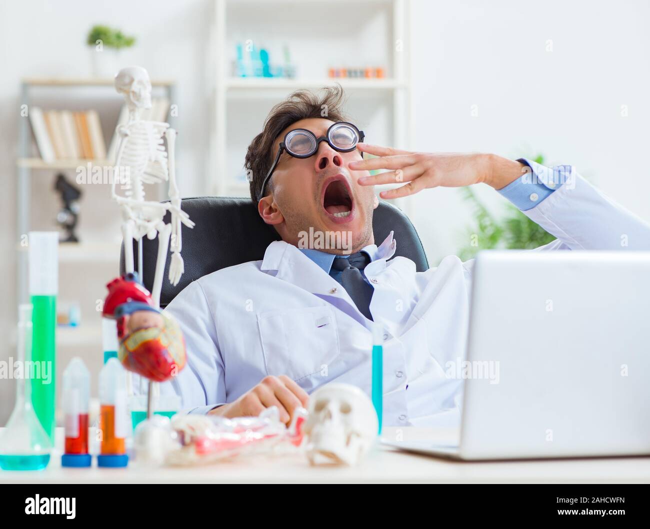 The funny doctor having fun in hospital lab Stock Photo - Alamy