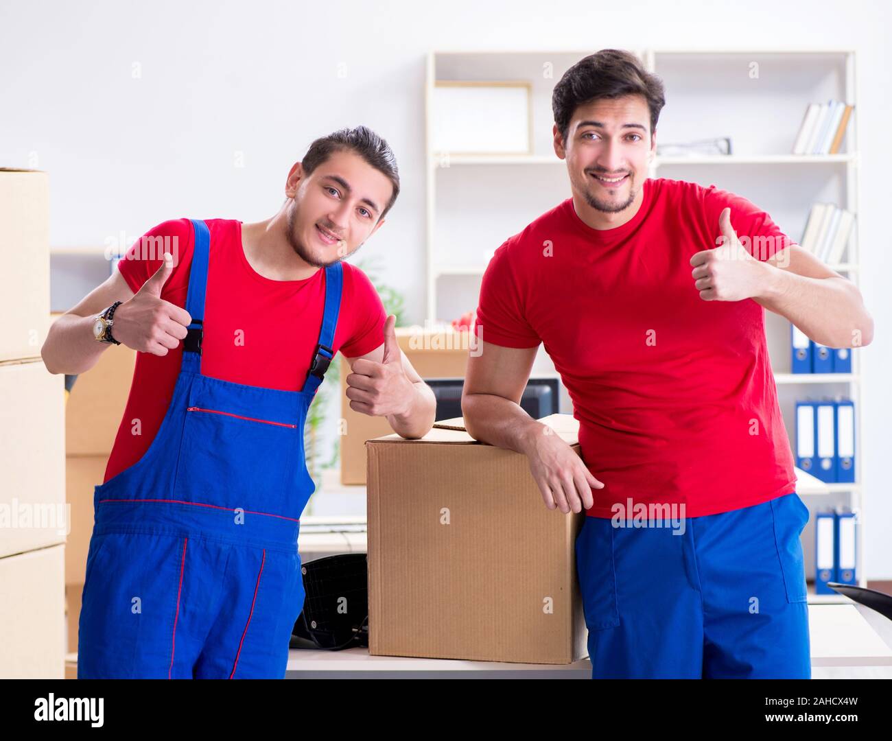 The two contractor employees moving personal belongings Stock Photo - Alamy