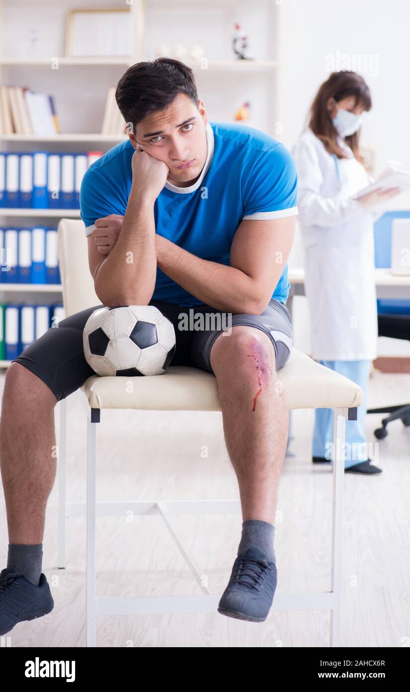 The football soccer player visiting doctor after injury Stock Photo - Alamy