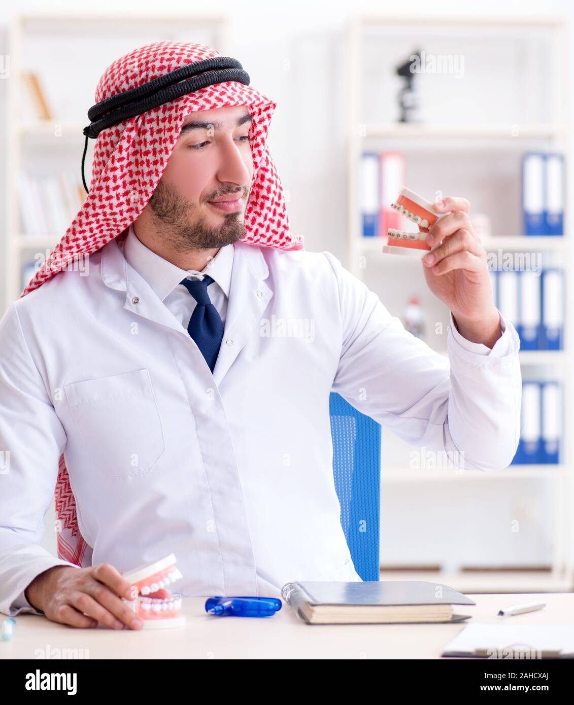 The arab dentist working on new teeth implant Stock Photo - Alamy