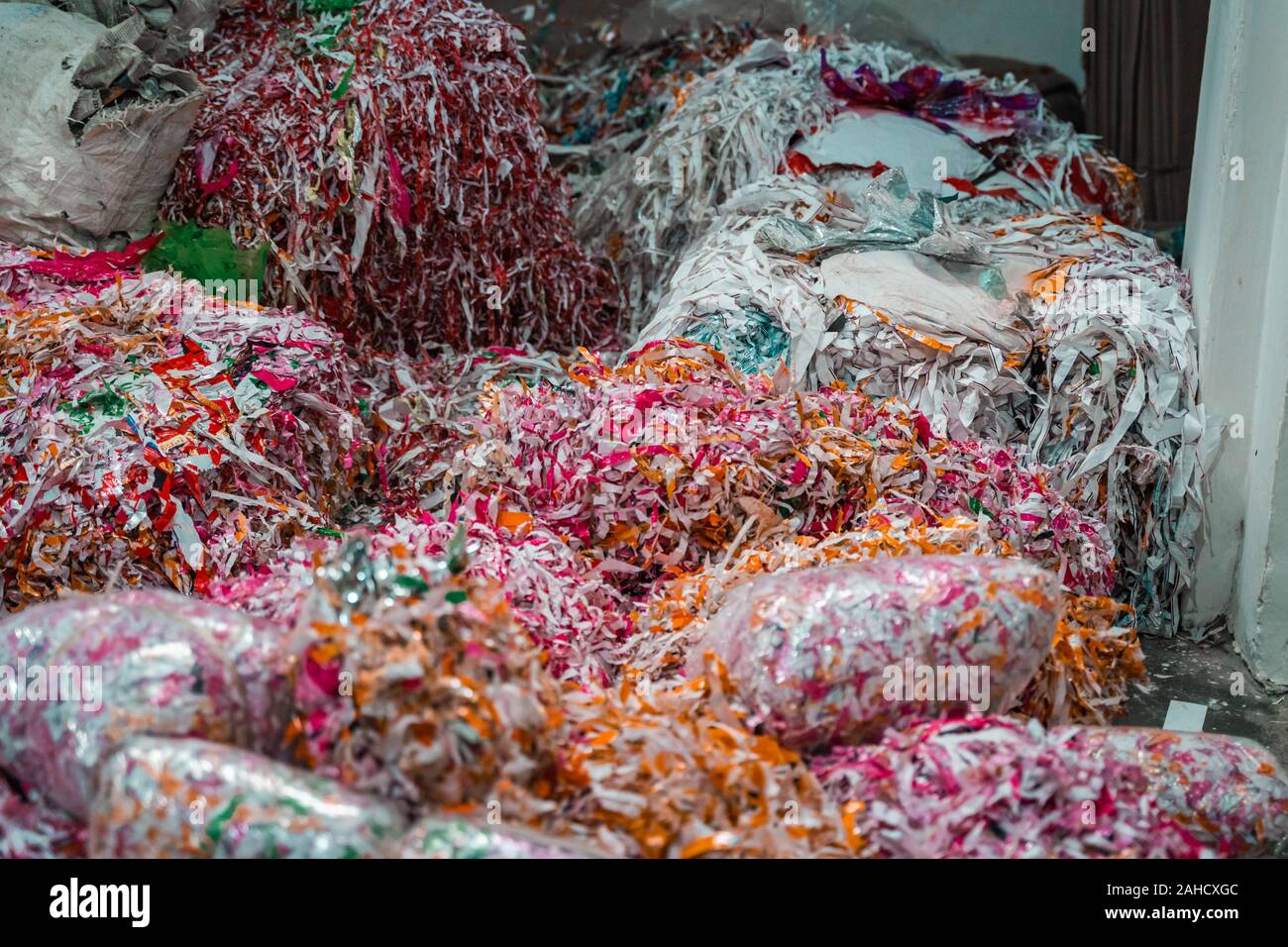 Colorful shredded paper in bunches and bundles, used for packaging ...
