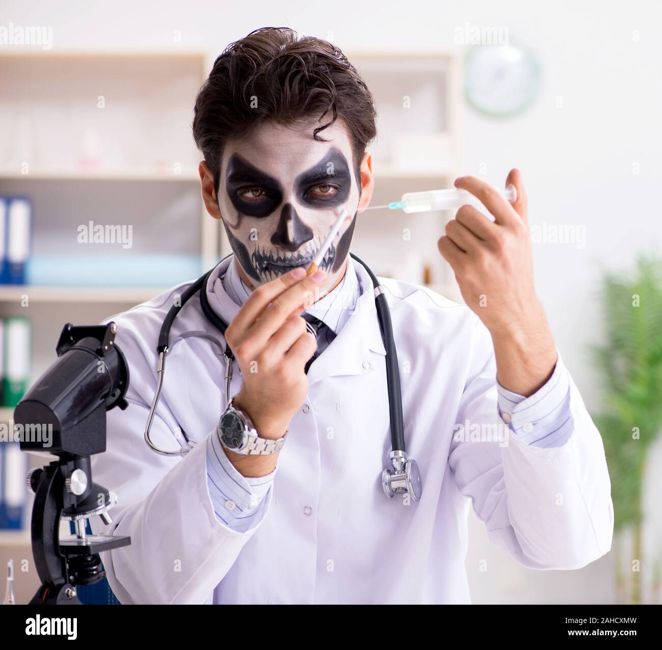 The scary monster doctor working in lab Stock Photo - Alamy
