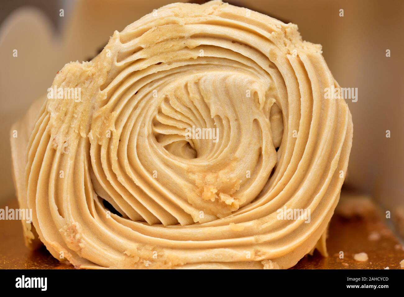 A swirl of icing at the end of a cake Stock Photo - Alamy