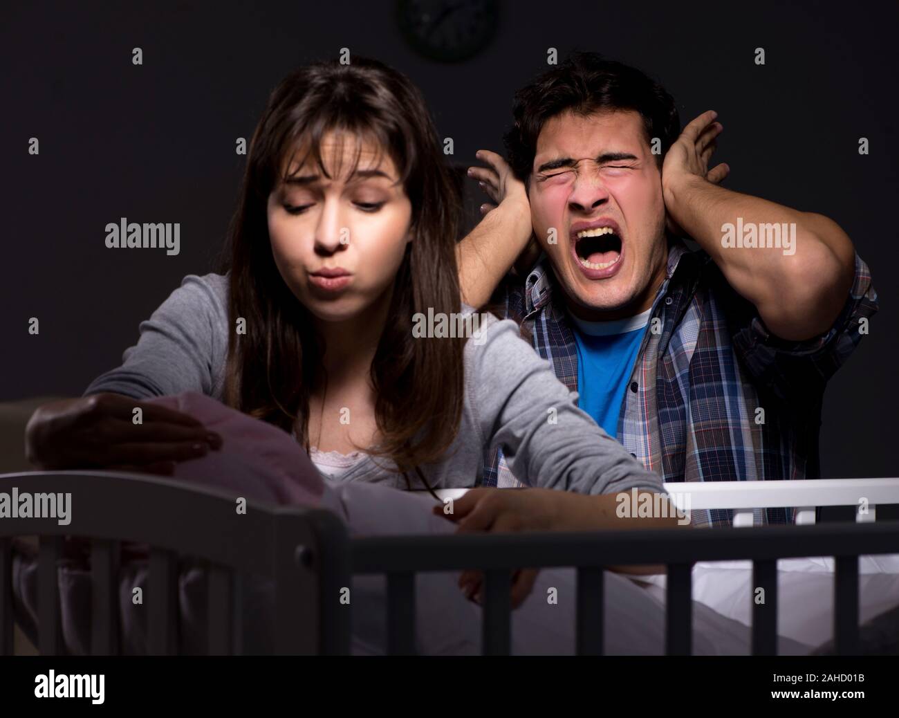 The young parents sleepless with newborn baby at night Stock Photo - Alamy
