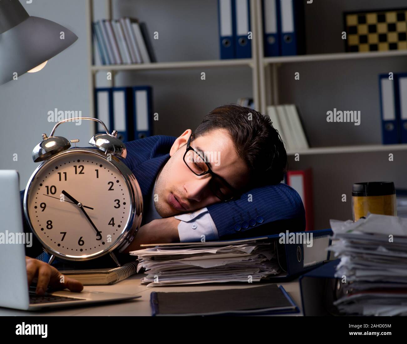 The businessman falling asleep during long hours in office Stock Photo ...
