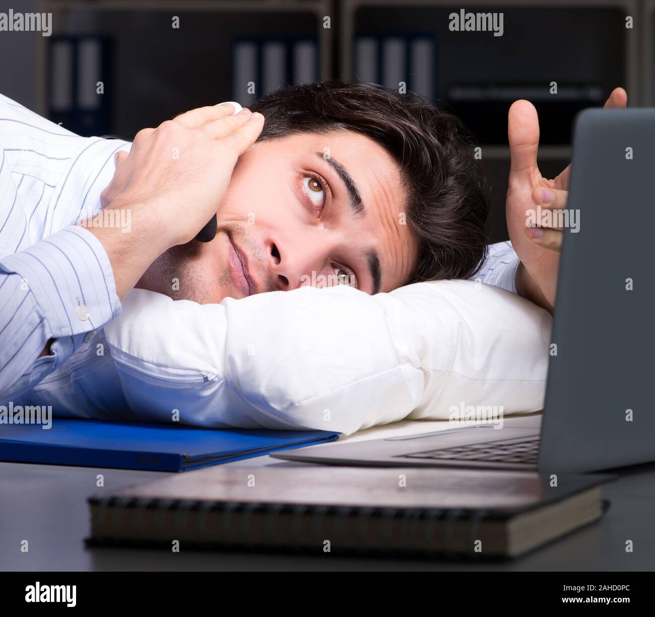 The tired and exhausted helpdesk operator during night shift Stock ...