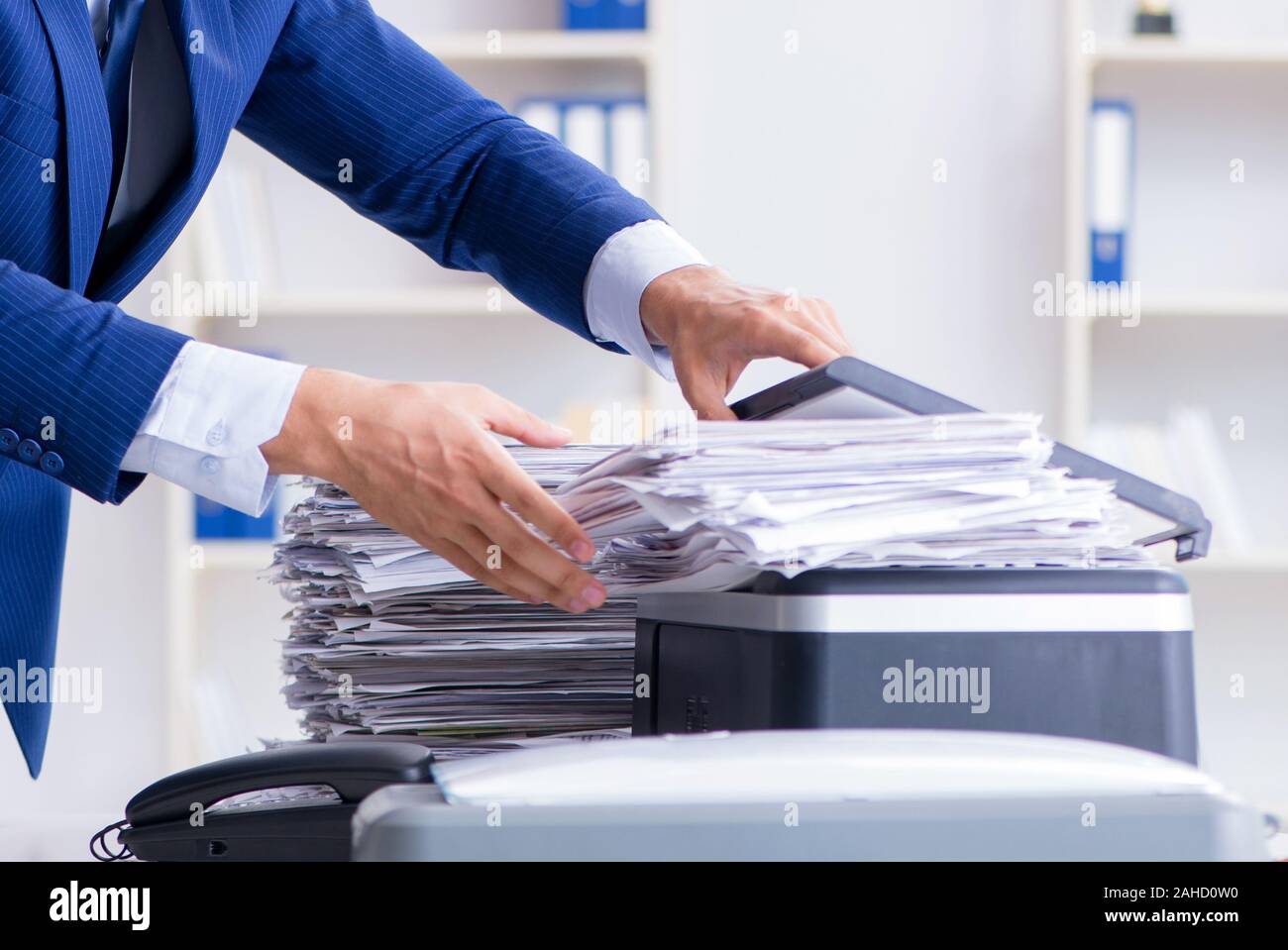 The businessman making copies in copying machine Stock Photo - Alamy