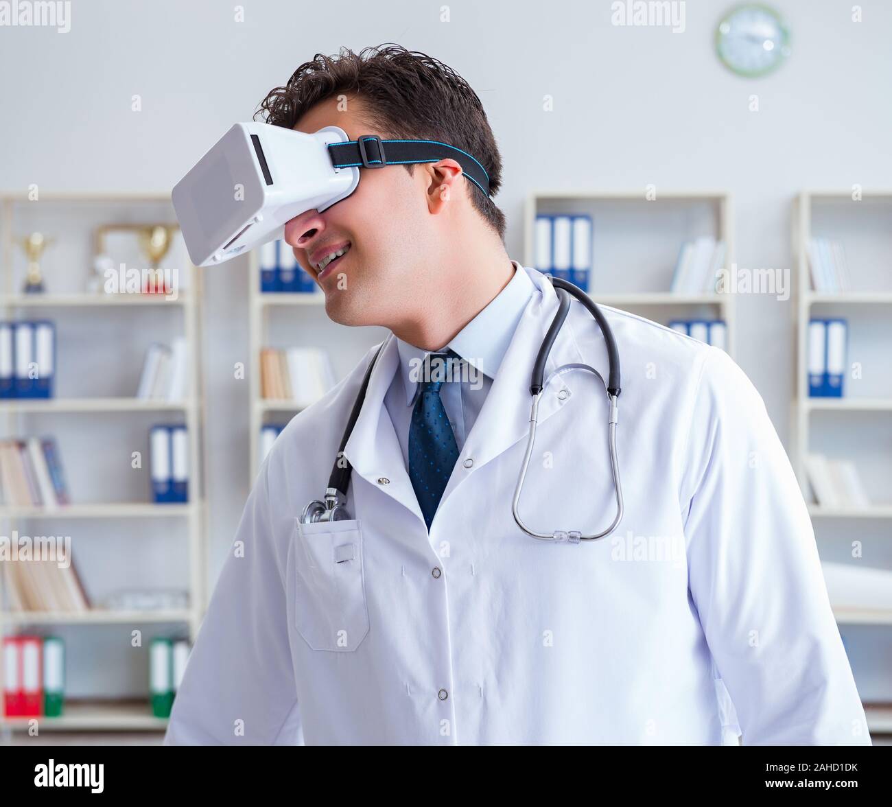 The young doctor looking at mri scan through vr glasses Stock Photo - Alamy