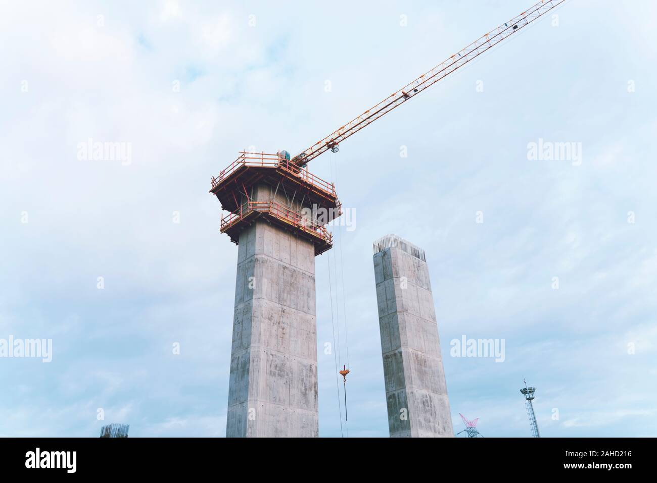 Construction of tall concrete pylon of bridge using tower crane Stock ...