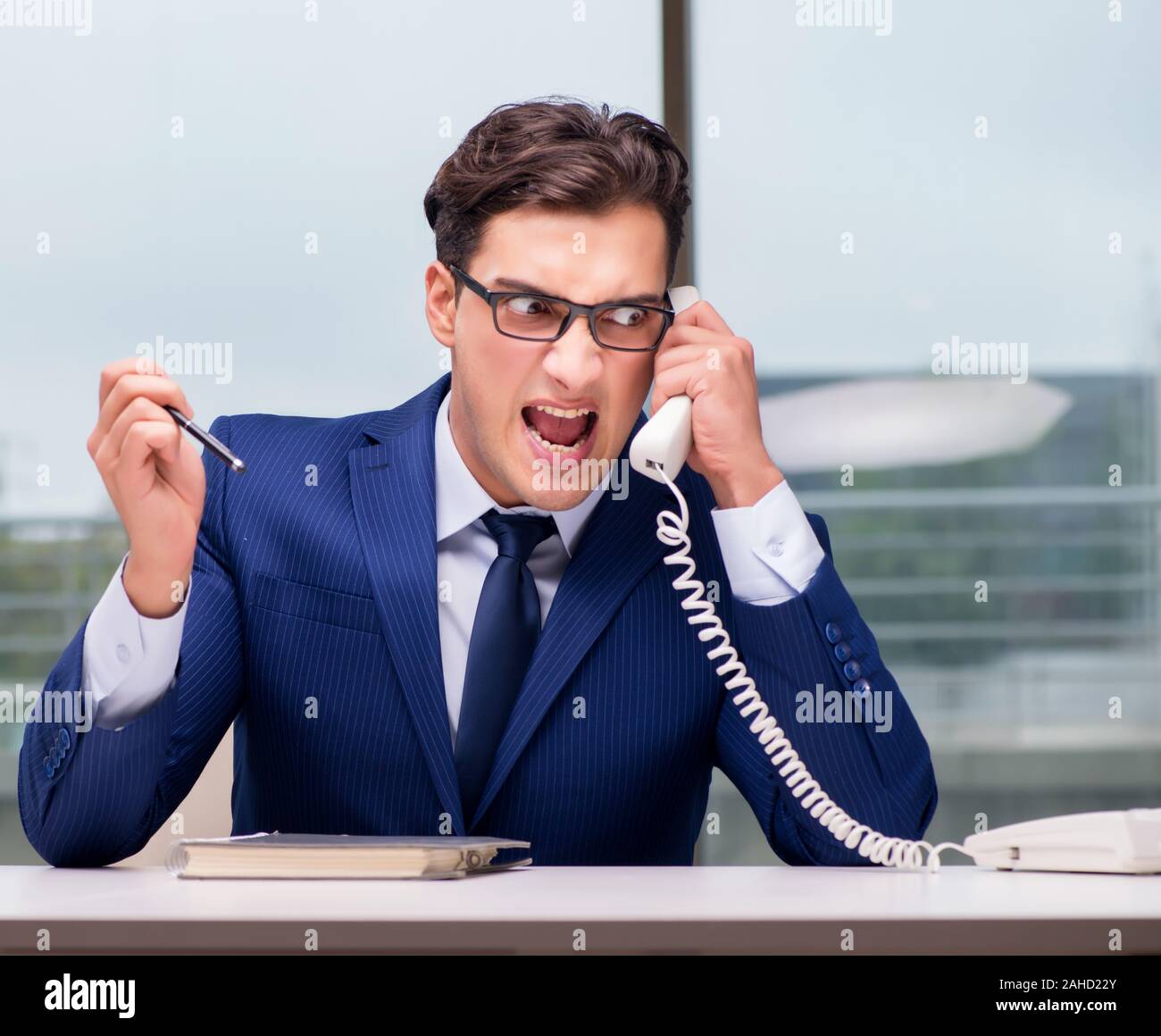 The angry call center employee yelling at customer Stock Photo - Alamy