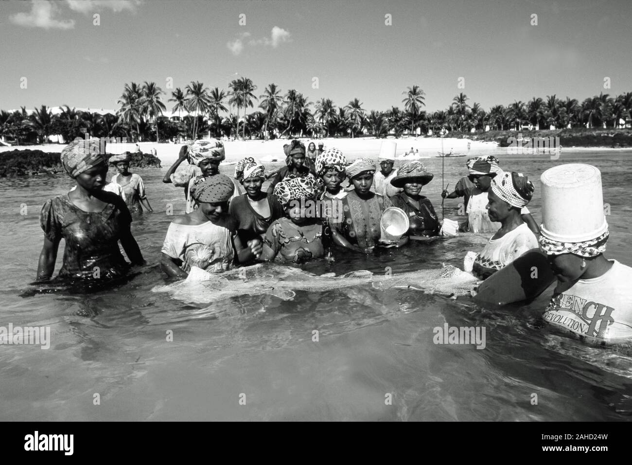 Comorian women are forming a circle to catch the fishes at Galawa Beach ...