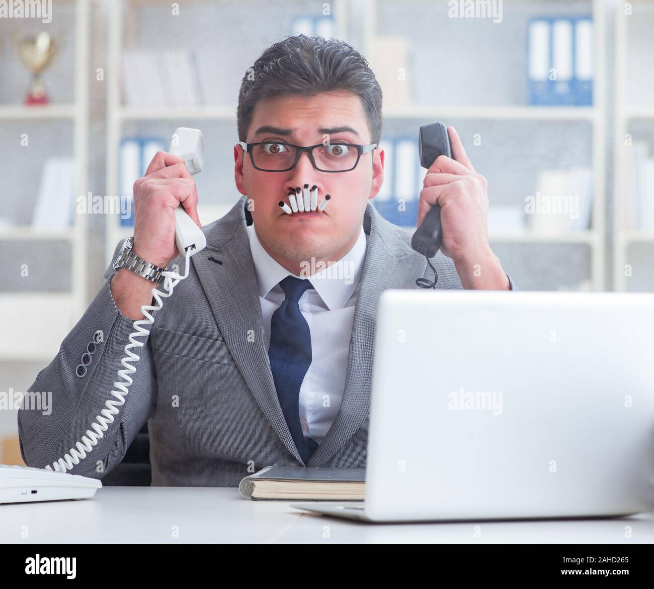 The businessman smoking in office at work Stock Photo - Alamy