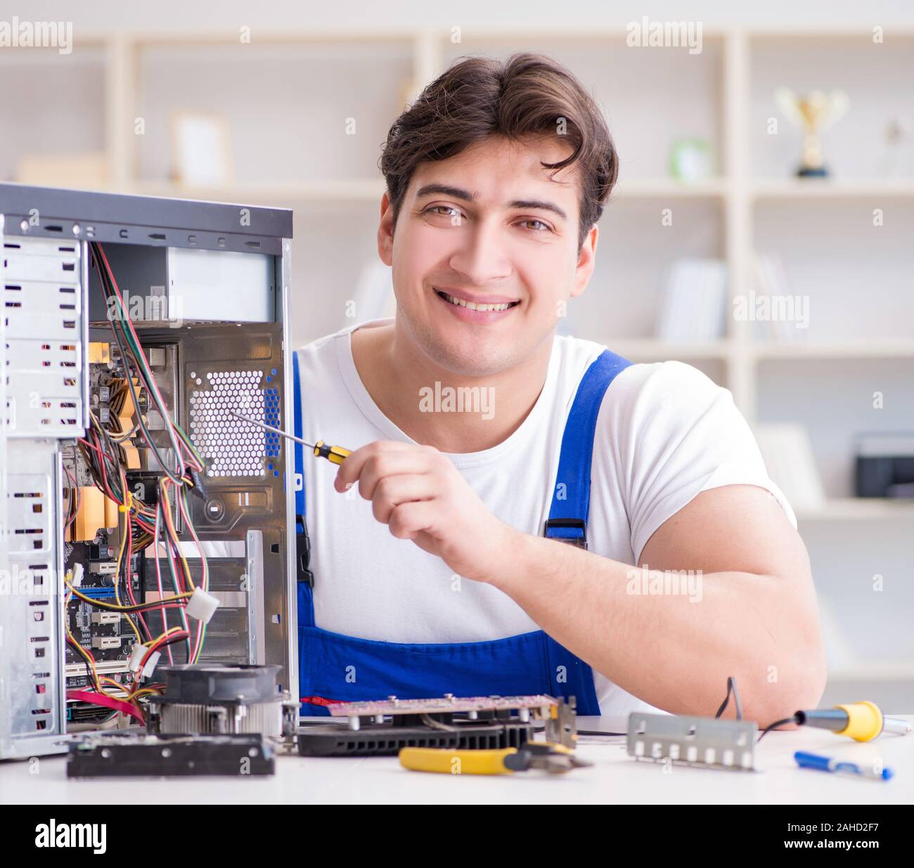 The computer repairman repairing desktop computer Stock Photo - Alamy