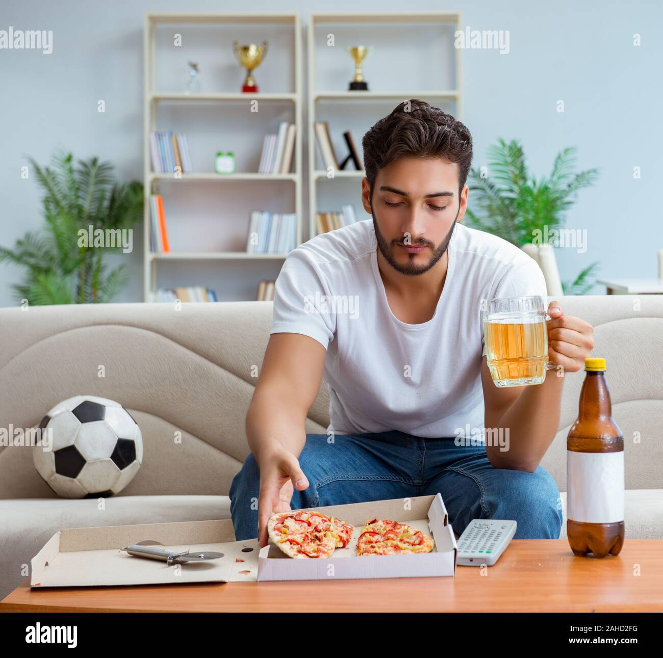 The man eating pizza having a takeaway at home relaxing resting Stock ...